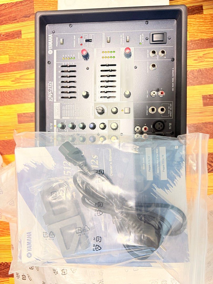 Yamaha EMX212S powered mixer. It is a 12-channel mixer with a built-in ...