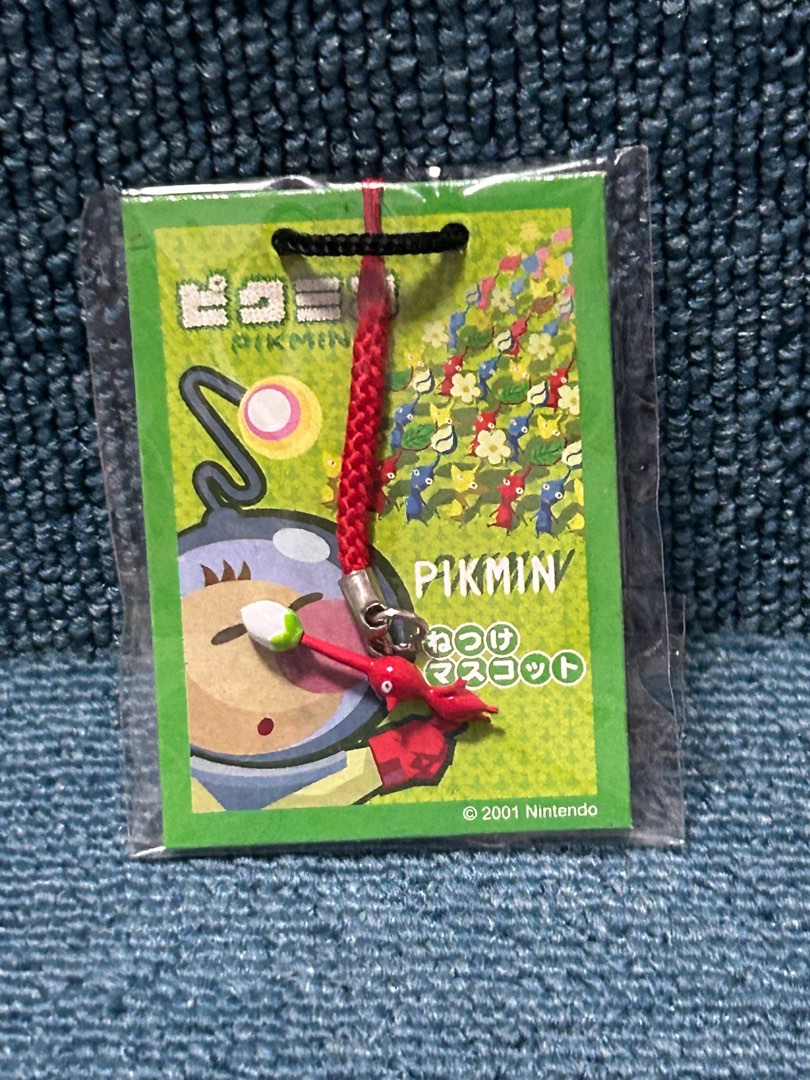 Pikmin-themed phone charm from 2001, featuring Captain Olimar and a Red ...