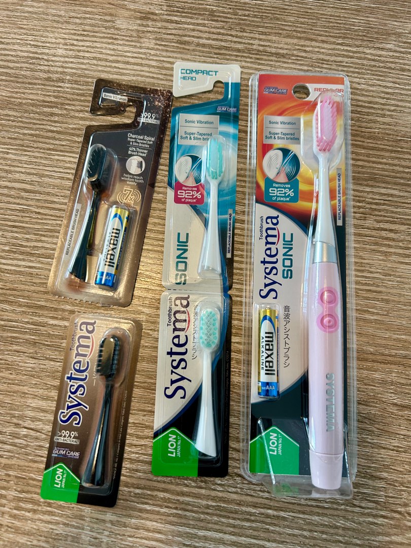 Systema Sonic electric toothbrush, refills brush heads and AAA battery ...
