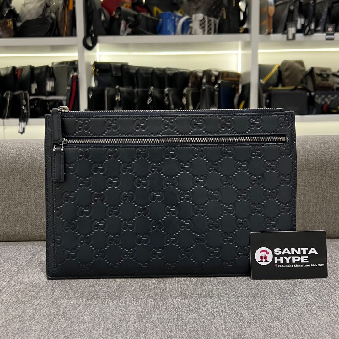 Gucci GG Logo Embossed Clutch, Men's Fashion, Bags, Belt bags, Clutches and Pouches on Carousell