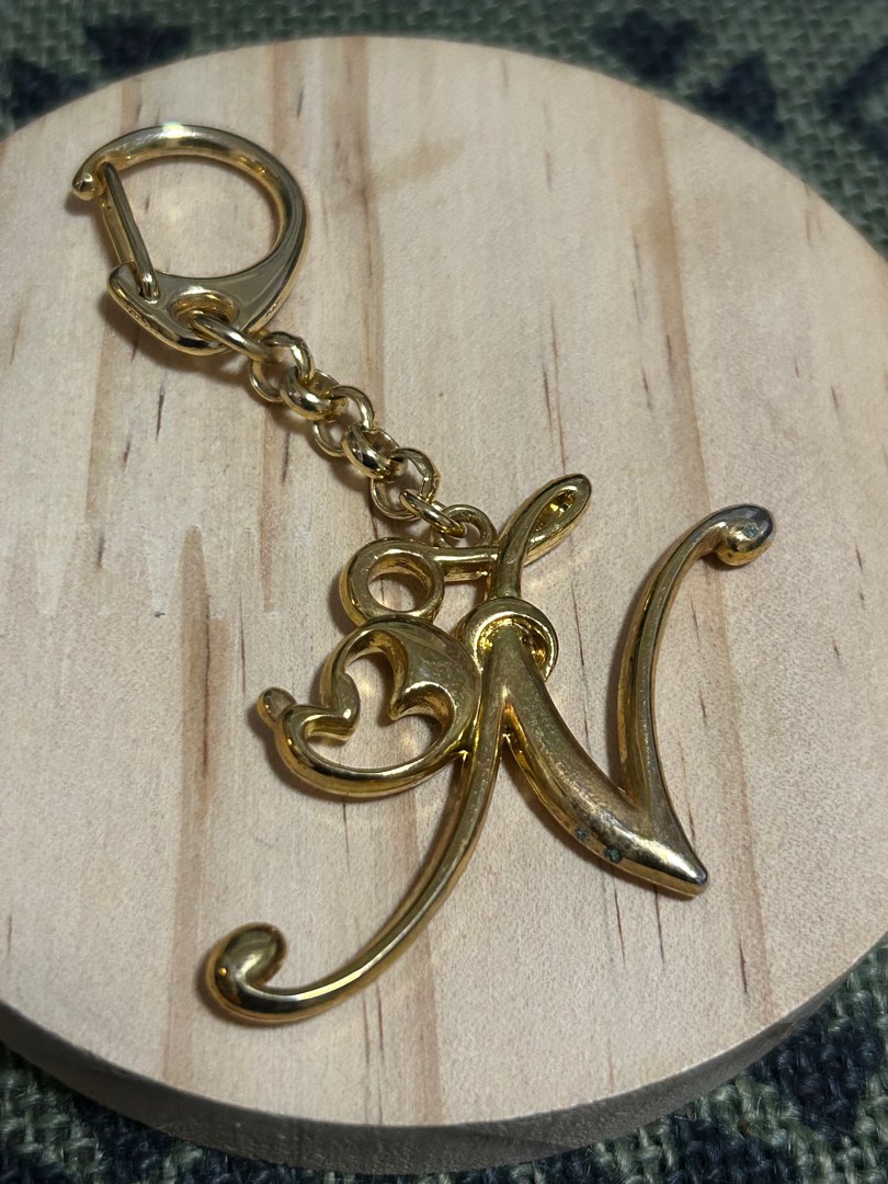 gold-colored keychain featuring Disney letter N, Everything Else ...