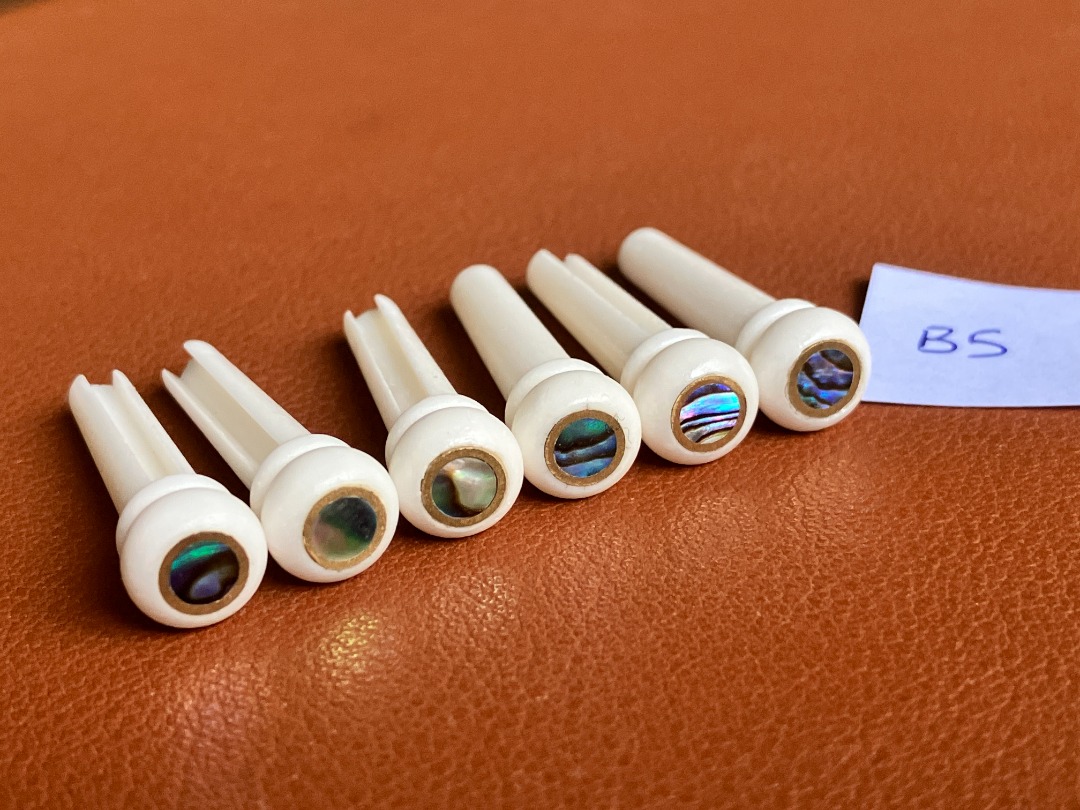 Real bone bridge acoustic guitar pins design with copper rims and ...