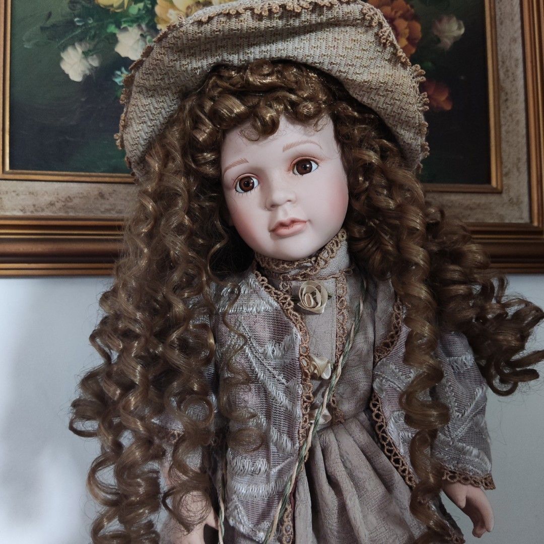 Collectible Elegant Porcelain Doll with Long Curly Hair, Wearing a ...
