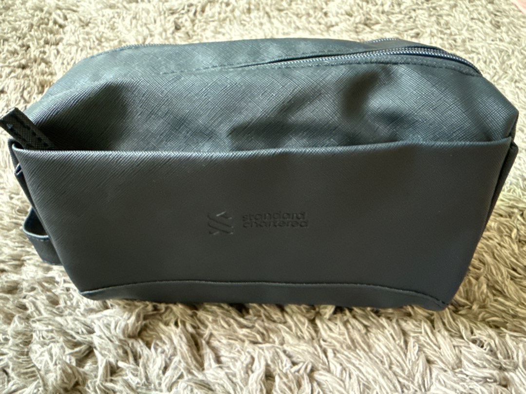 Multi-compartment pouch with faint Standard Chartered logo, Men's ...