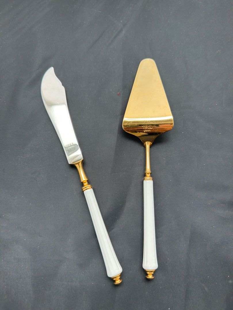 TBCL Japan butter knives, with one featuring a gold handle and the ...