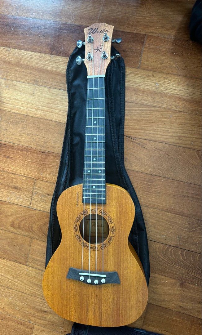 Ukulele with Case, Hobbies & Toys, Musical Instruments on Carousell