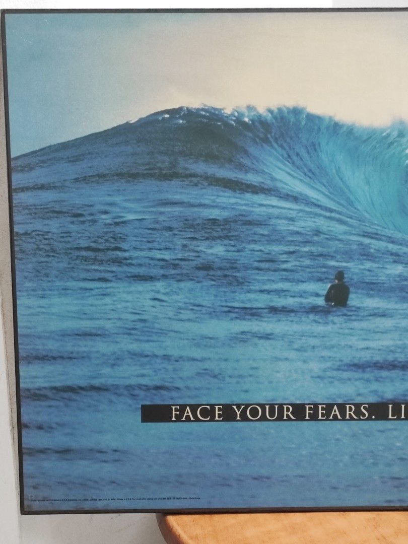 Wooden Frame with poster featuring a large ocean wave and a lone surfer ...