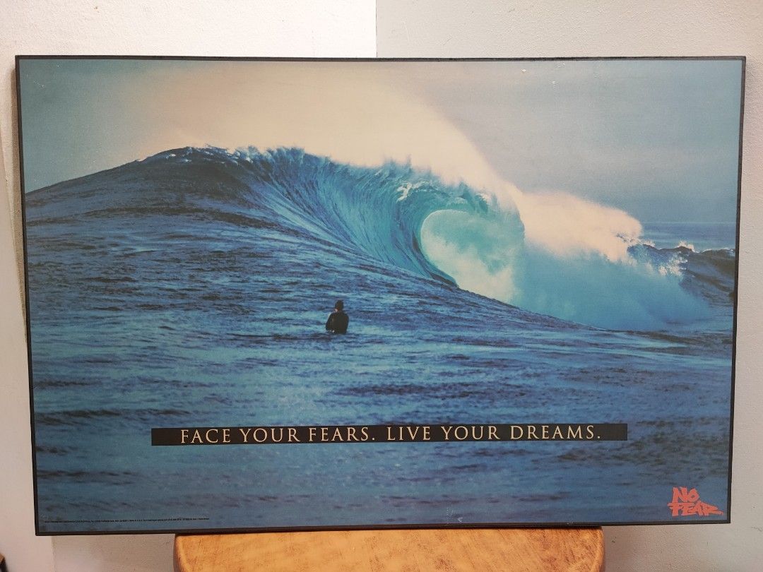 Wooden Frame with poster featuring a large ocean wave and a lone surfer ...