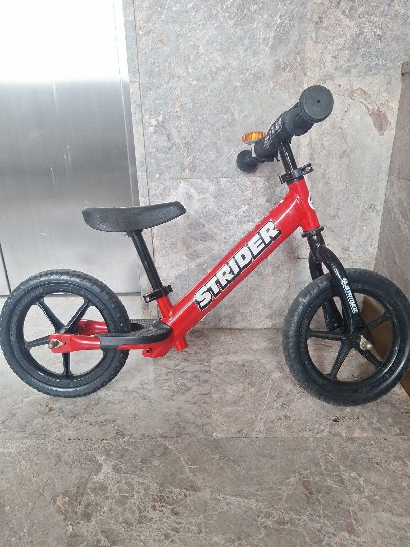Strider Balance Bike - Red, Sports Equipment, Bicycles & Parts, Bicycles on Carousell