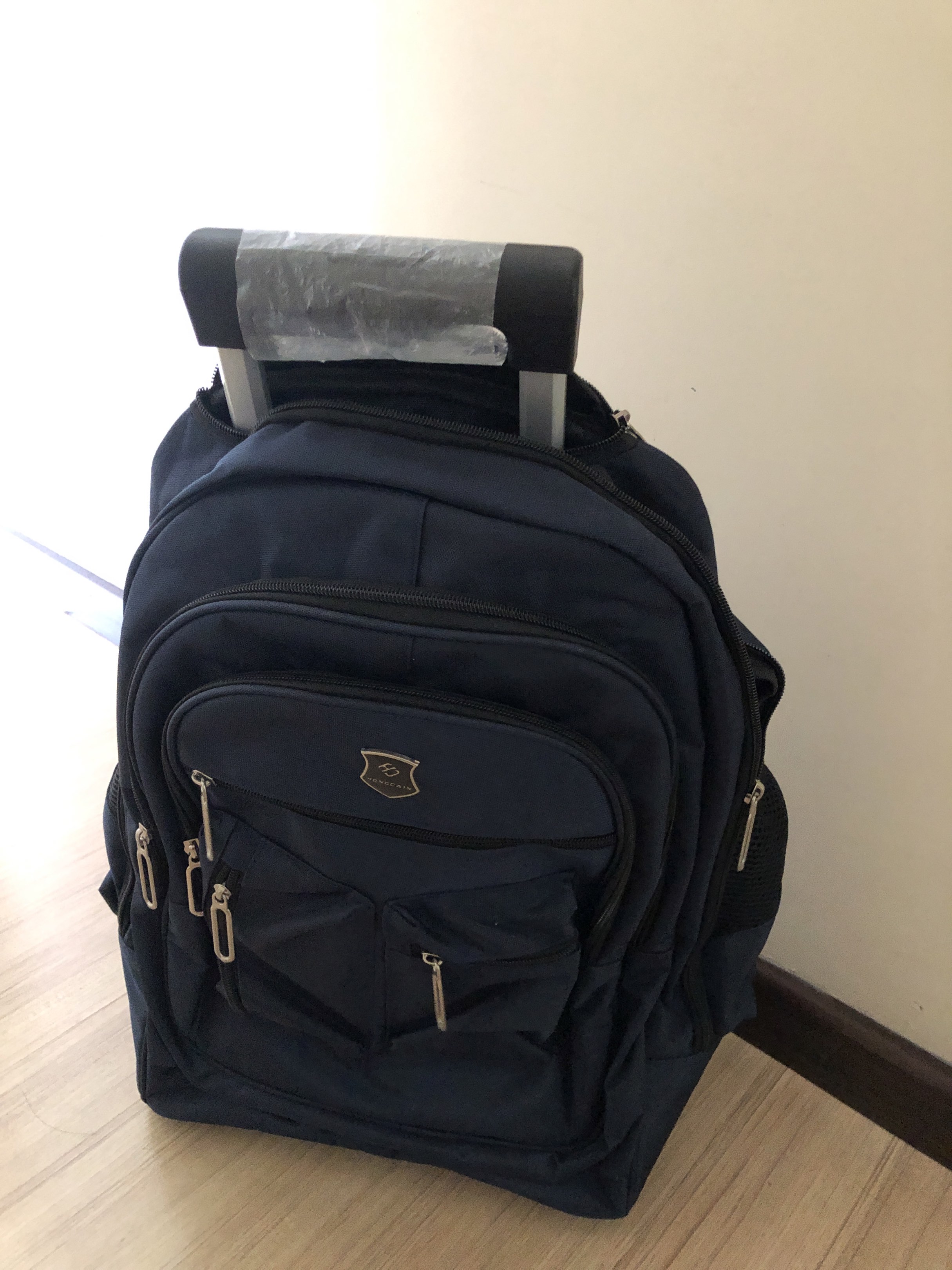 Navy Blue Rolling Backpack, Men's Fashion, Bags, Backpacks on Carousell