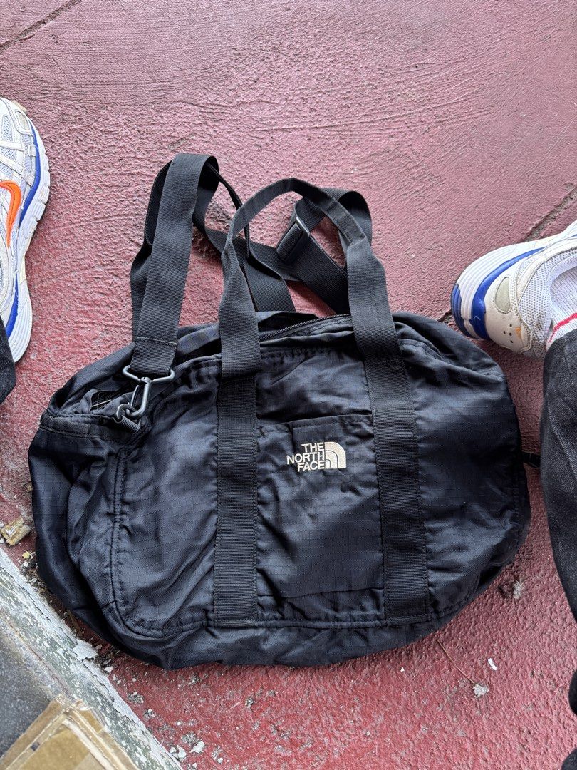 The North Face Duffle Bag, Men's Fashion, Bags, Sling Bags on Carousell