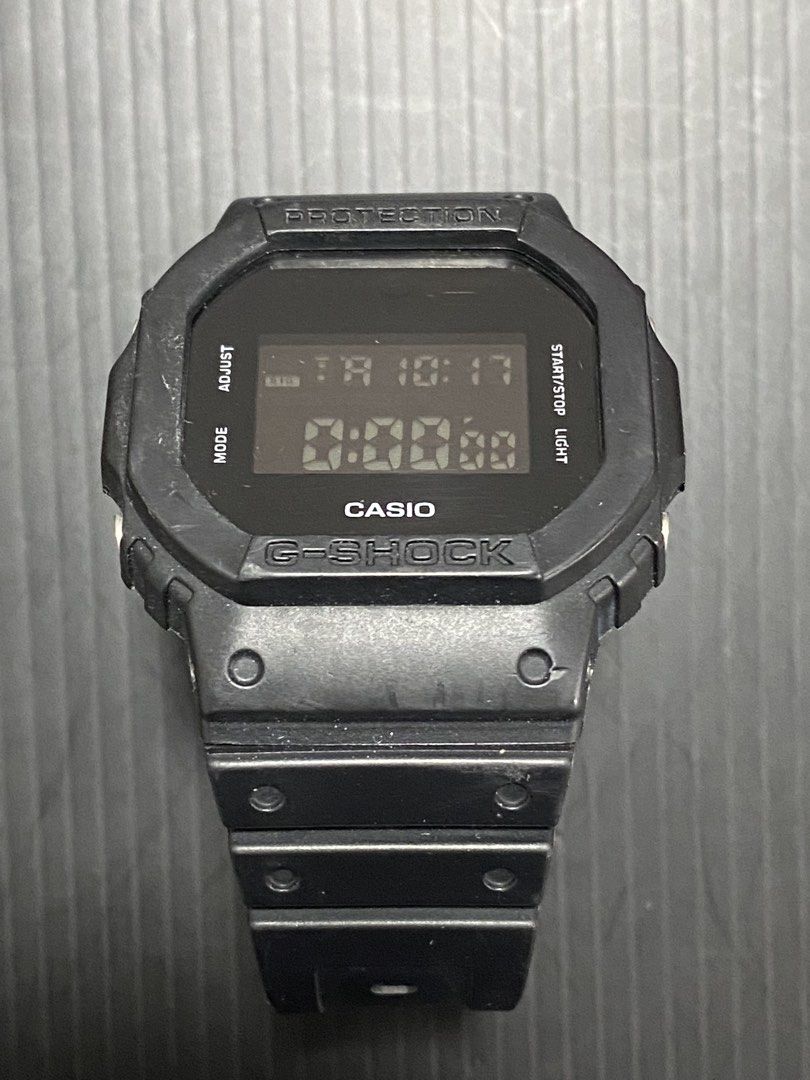 Casio G-Shock DW-5600BB-1 watch, featuring a black-on-black design with ...