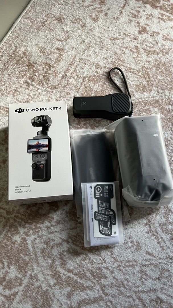 DJI Osmo Pocket 4 (creator combo), Photography, Video Cameras on Carousell